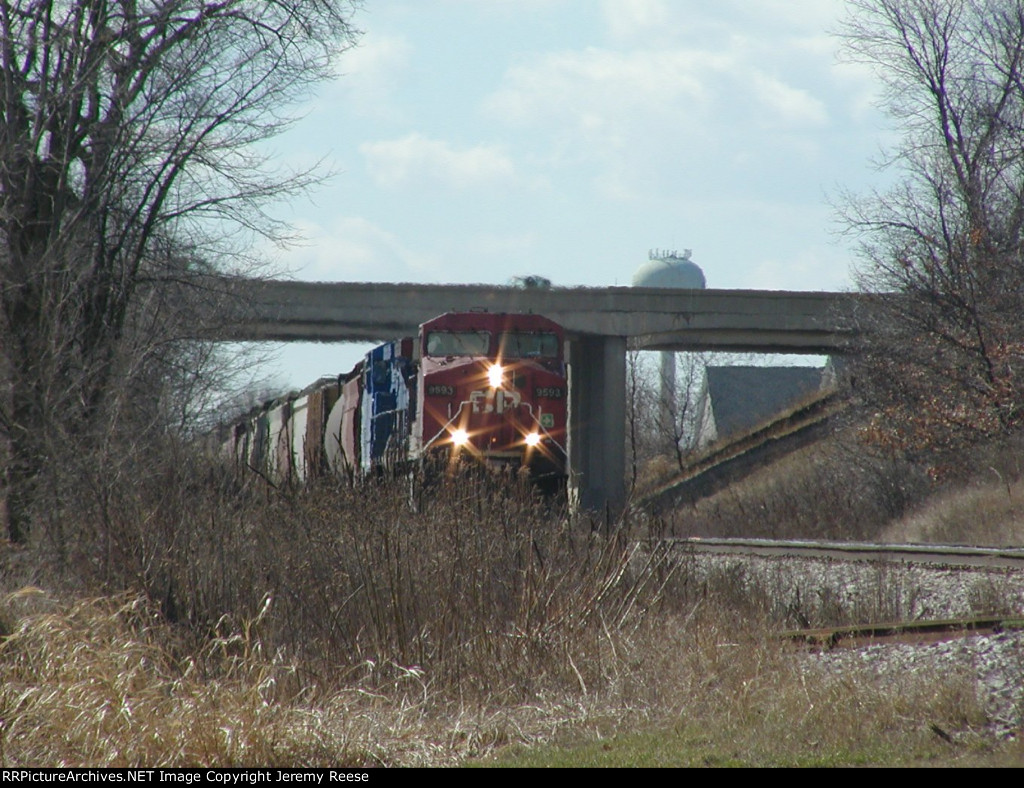 CP 9593 with the highway overpass framing it